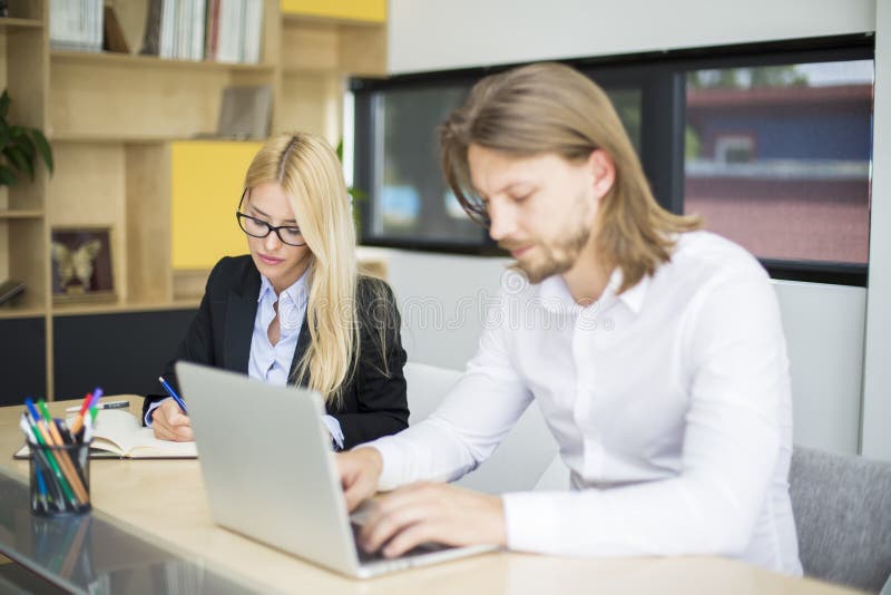 Two Business People Discussing New Project in Modern Office Stock Photo ...