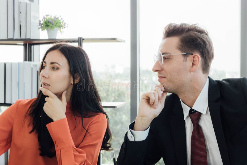 Two Business People Discussing about Work in an Office Stock Image ...