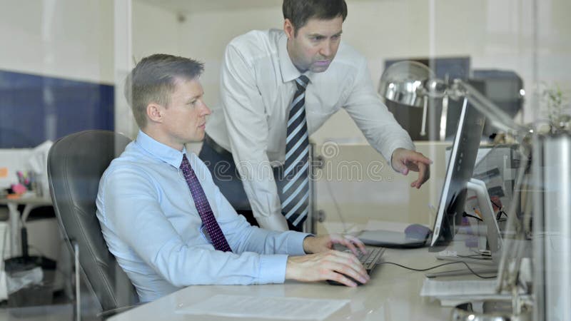 Two Business People Discussing Work on Office Computer Screen Stock ...