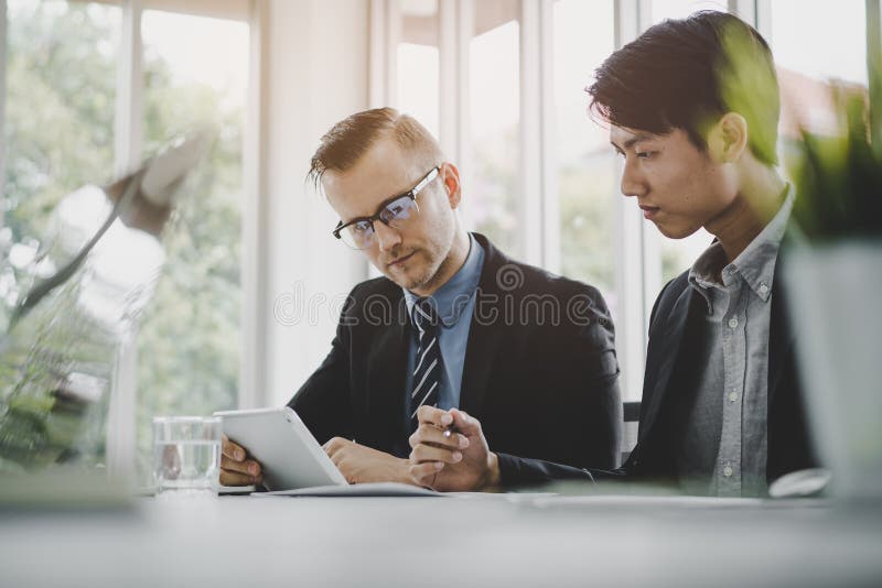 Two Business People Discussing Work in the Office in Meeting Stock ...