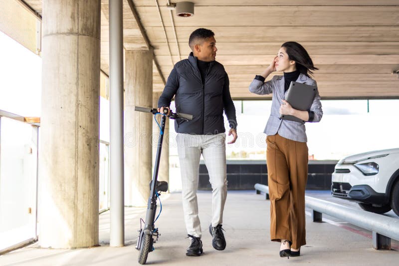 Two Business People with Electric Scooter Talking Outside Stock Image ...