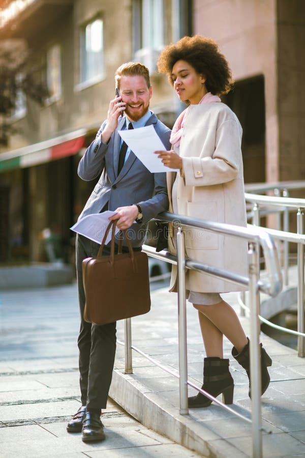 Two Business People in an Informal Conversation Stock Photo - Image of ...