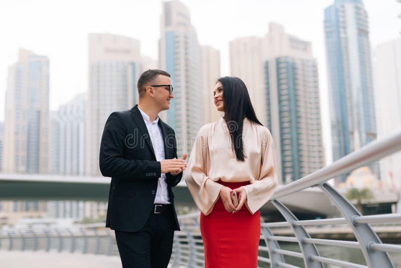 Two Business People in an Informal Conversation in Front of a Business ...