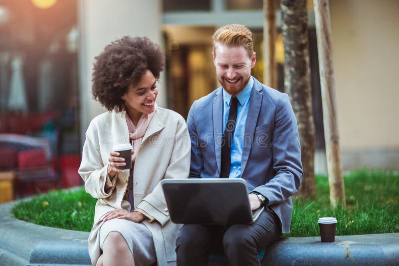 Two Business People in an Informal Conversation in Front of a Business ...
