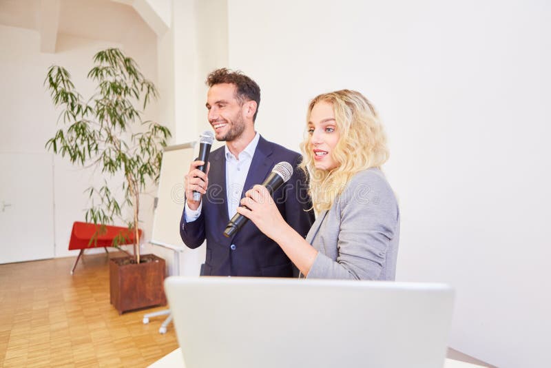 Two Business People at a Joint Presentation Stock Photo - Image of ...