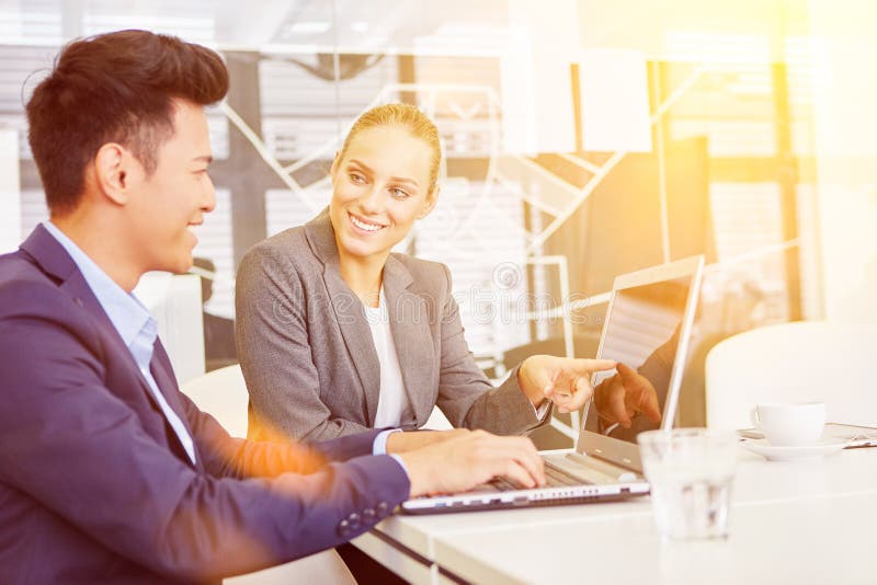 Two Business People with Laptop Computer Stock Photo - Image of ...