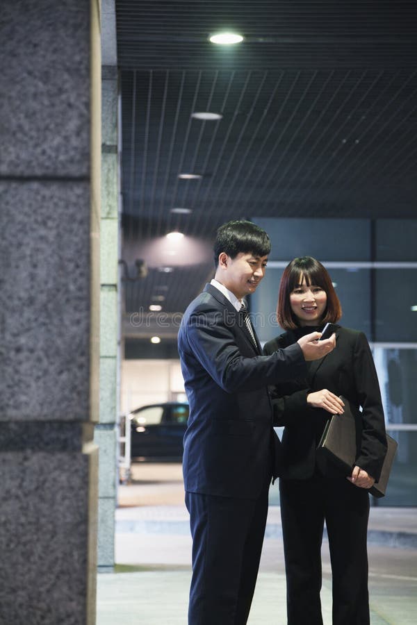 Old Man Looking for His Car in a Parking Lot by Pushing the Unlock ...