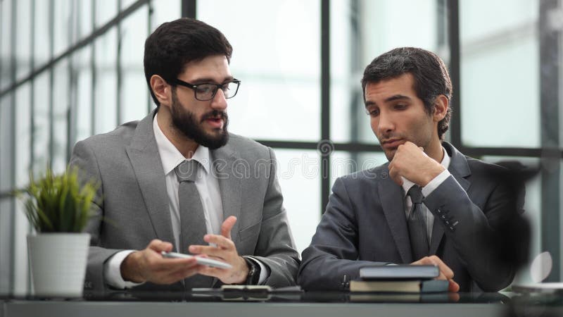Two Business People in the Office at the Table Stock Photo - Image of ...