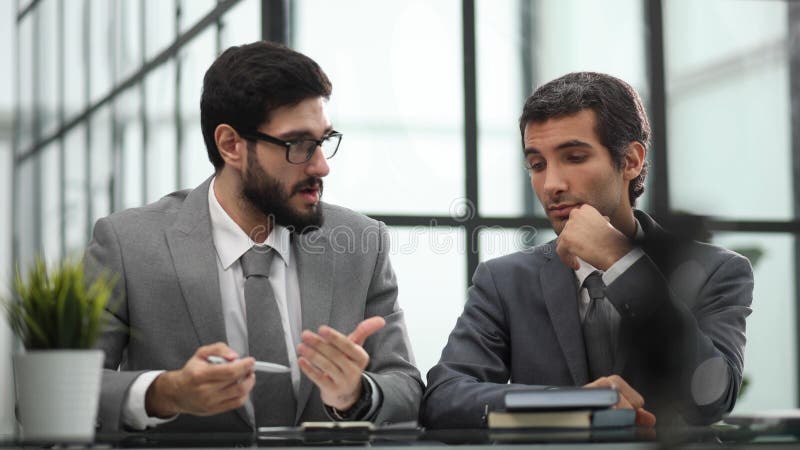 Two Business People in the Office at the Table Stock Image - Image of ...
