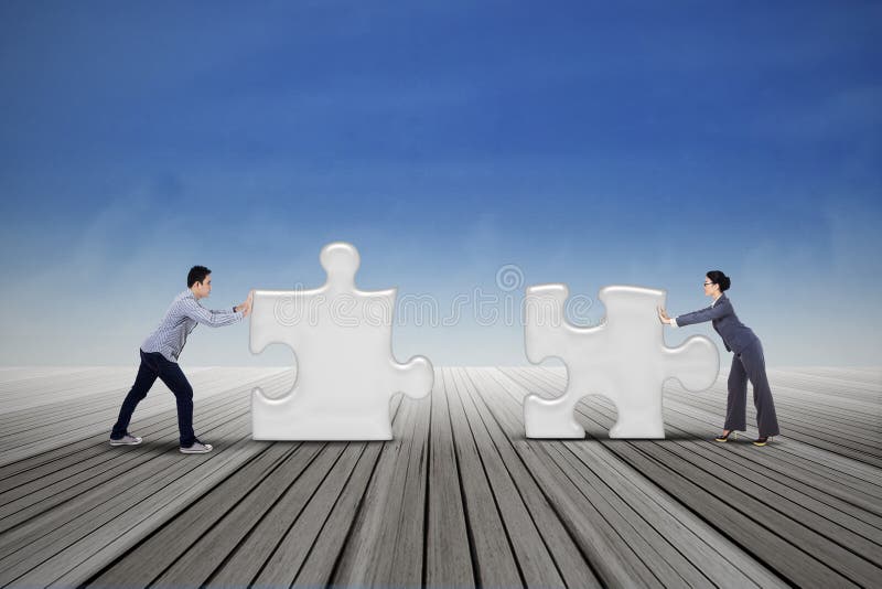 Two Business People Put Two Puzzles Stock Image - Image of partnership ...