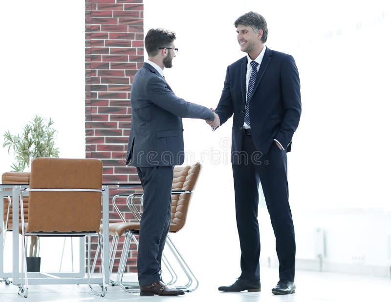 Two Business People Shake Hands in the Office Stock Photo - Image of ...