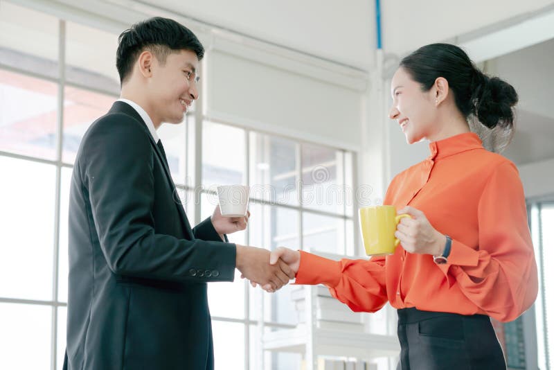 Two Business People Shaking Hands on Coffee Break Stock Image - Image ...