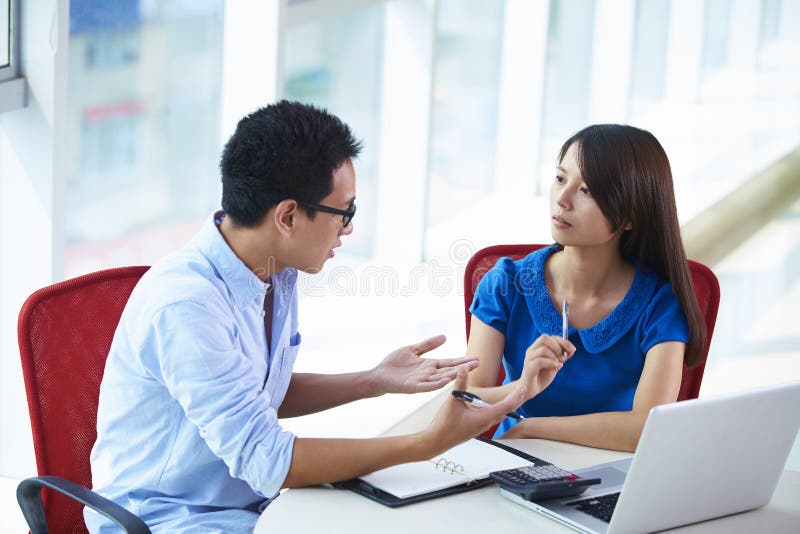 Two Business People Talking in the Office Stock Photo - Image of ...
