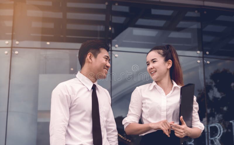 Two Business People Talking Together at Office Building. Stock Image ...