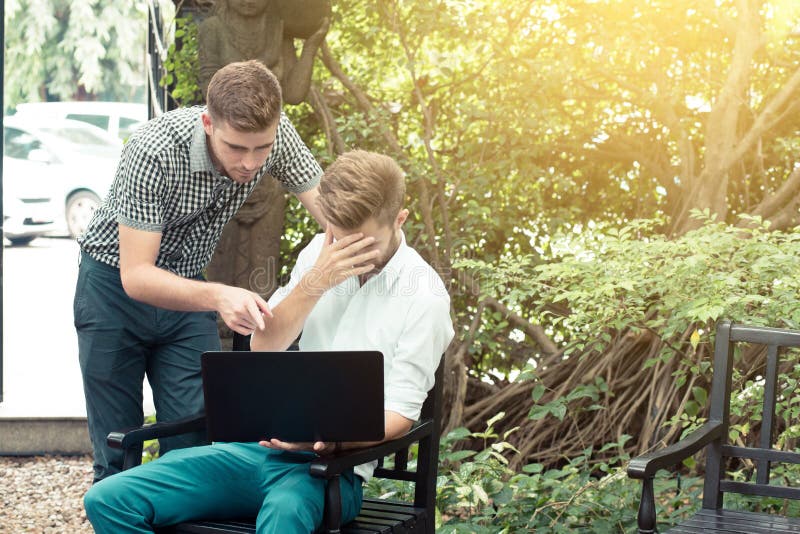 Two Business People Use of the Notebook Computer at Outdoor. Stock ...
