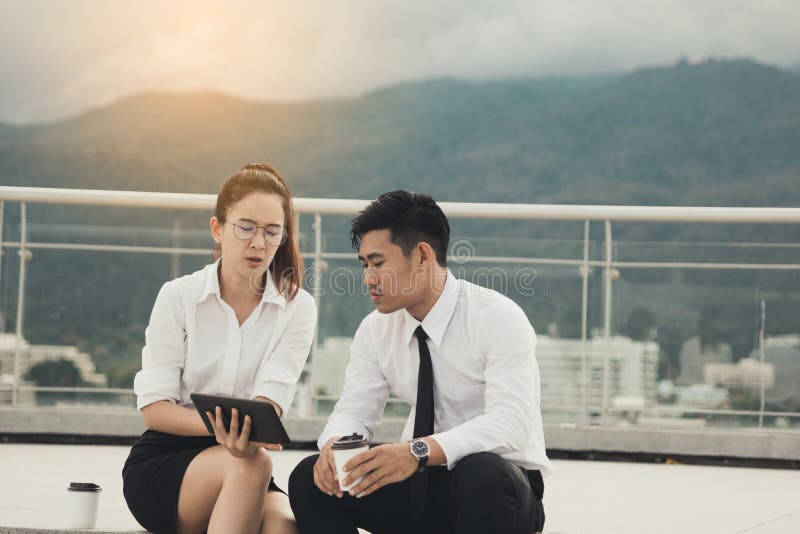 Two Business People Using Digital Tablet at Outside Business Office ...