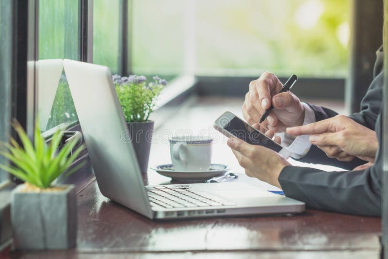 Two Business People Using Mobile Phones while Working. Stock Image ...