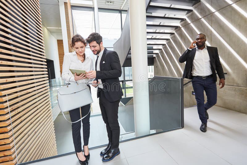 Two Business People with a Tablet Computer Stock Image - Image of ...