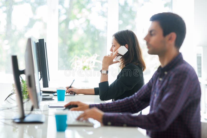 Two Business People Working in the Office Stock Photo - Image of ...