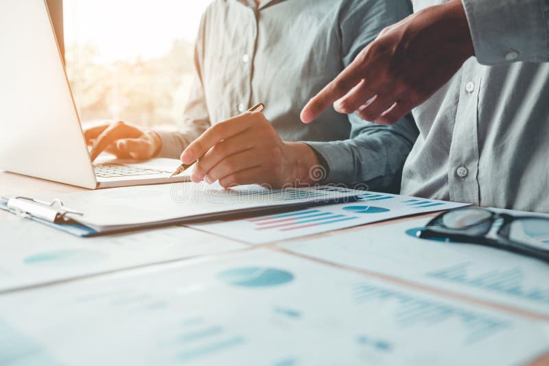Two Business People Working Together on Laptop Meeting with Tech Stock ...