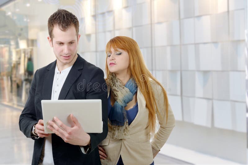 Two Business People Working Together with a Laptop Stock Photo - Image ...