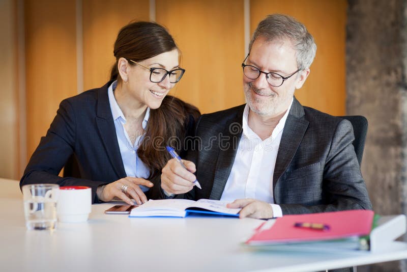 Two Business Person Working at the Office on Exciting Project. Stock ...