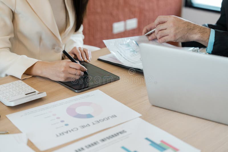 Business Professionals Collaborating on Financial Analysis Using ...