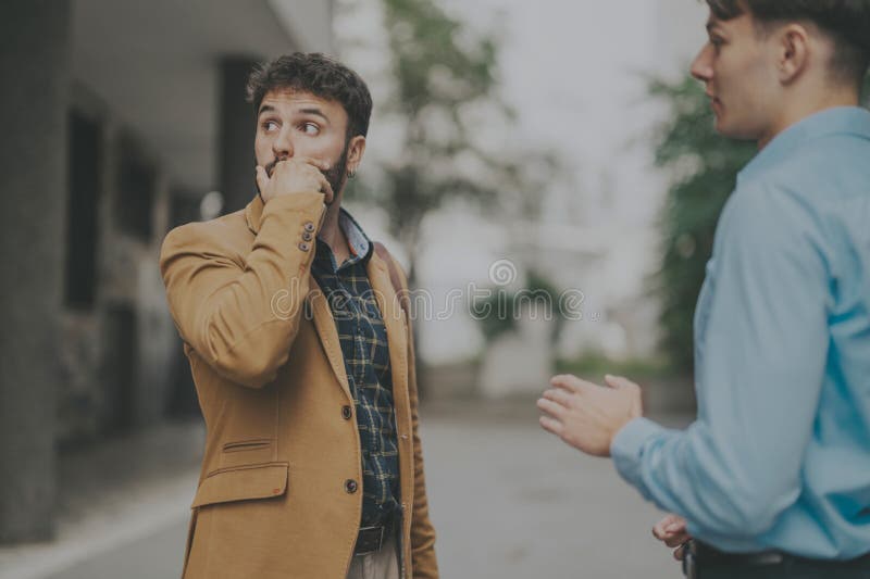 Two Business Professionals Having a Conversation Outdoors in a City ...