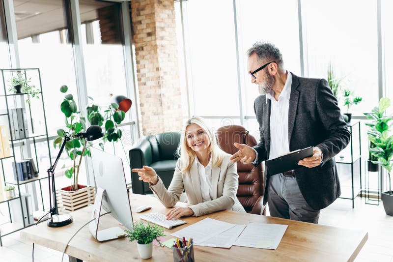 Professional Office Setting with Business Colleagues Collaborating on ...