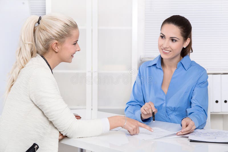 Two Business Woman at Desk - Application or Interview - Talking Stock ...