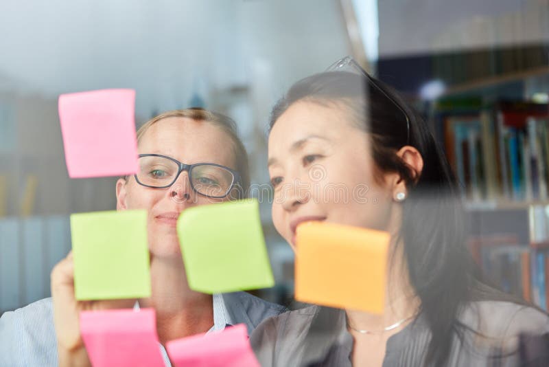 Two Business Women Collect Ideas on Slips Stock Photo - Image of staff ...