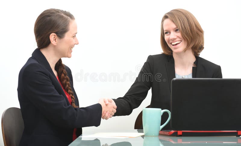 Two Business Women in Interview or Negotiation Shaking Hands Stock ...
