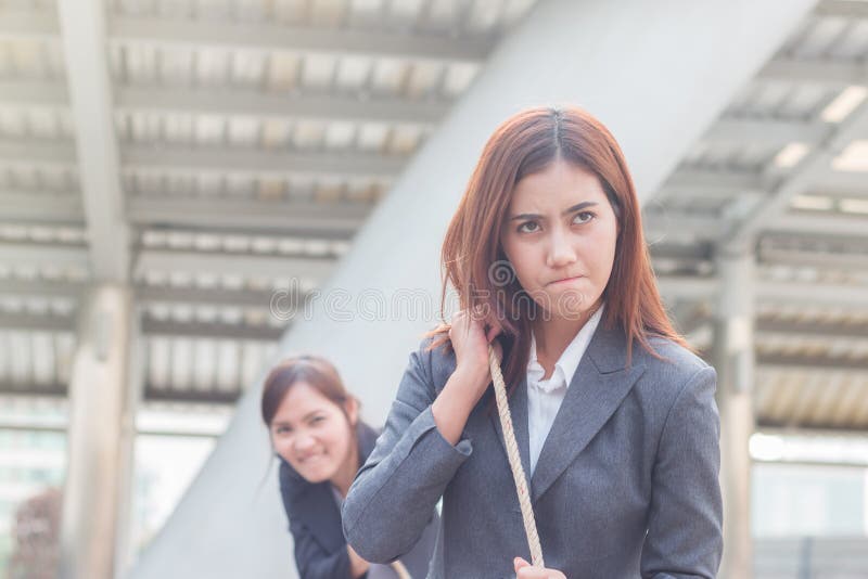 Two Business Women Pulling a Rope Competing with Commitment To Winer ...