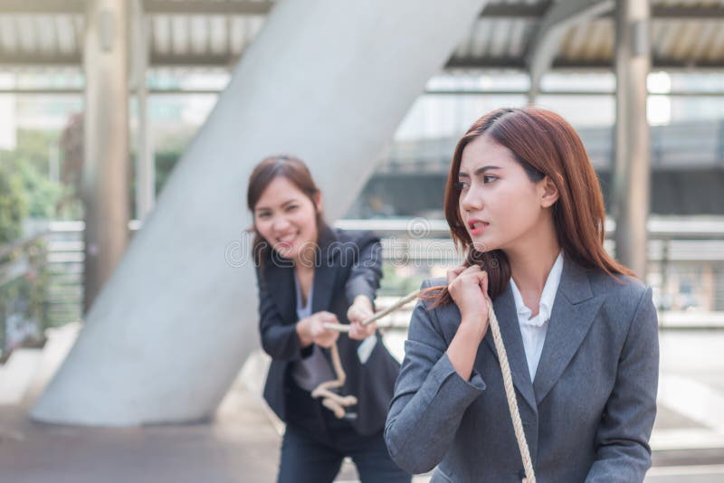 Two Business Women Pulling a Rope Competing with Commitment To Winer ...