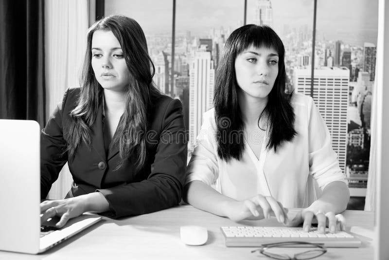 Two Business Women Working in Office with Computer in New York Stock ...
