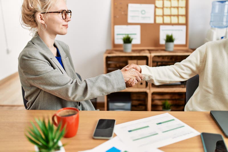 Two Business Workers Shaking Hands at the Office Stock Image - Image of ...