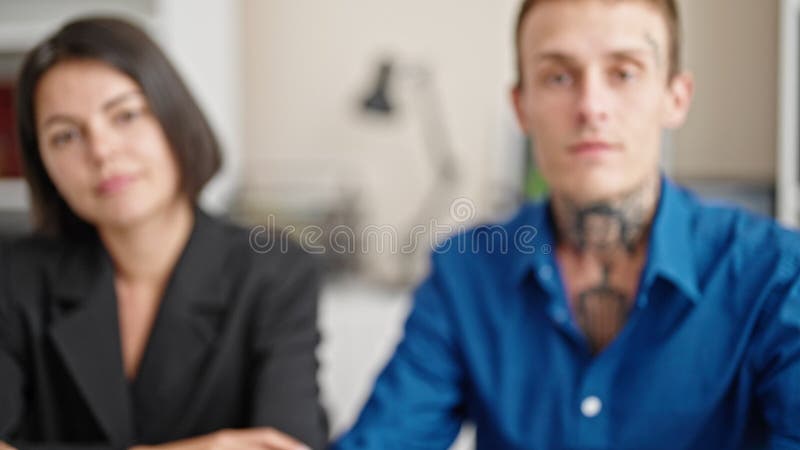 Two Business Workers Sitting on Table with Serious Face at the Office ...