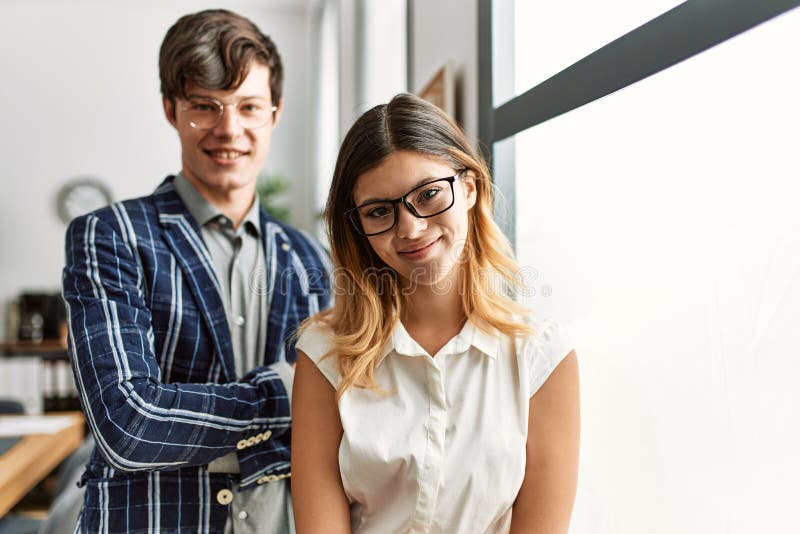 Two Business Workers Smiling Happy with Arms Crossed Gesture at the ...