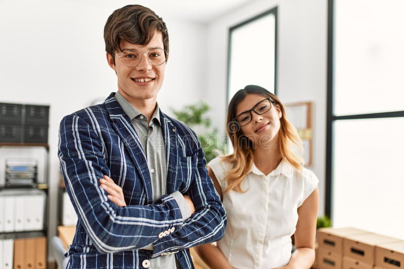 Two Business Workers Smiling Happy with Arms Crossed Gesture at the ...