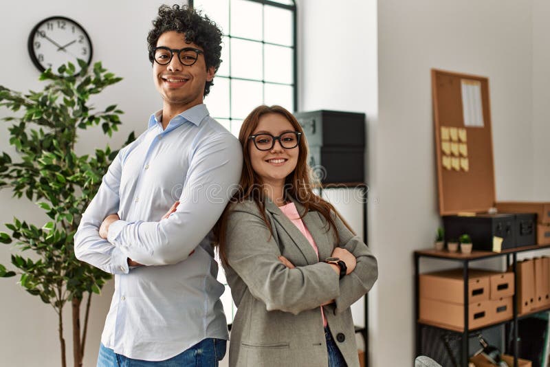 Two Business Workers Smiling Happy with Arms Crossed Gesture at the ...