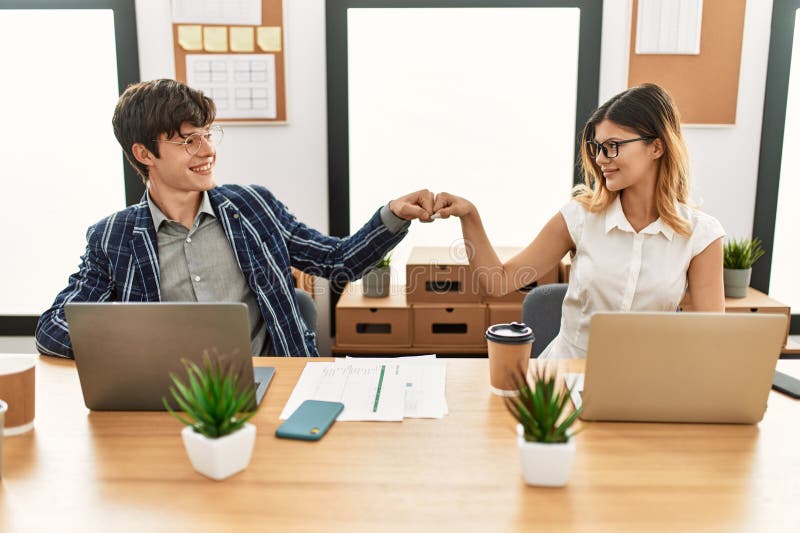 Two Business Workers Smiling Happy Bump Fists at the Office Stock Image ...