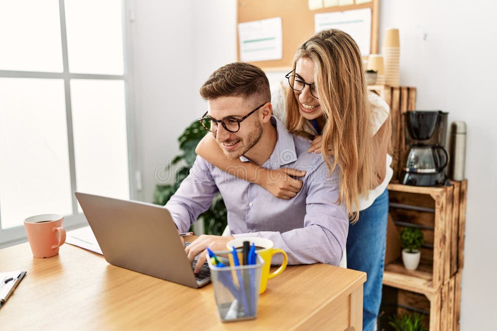 Two Business Workers Smiling Happy and Hugging Working at the Office ...