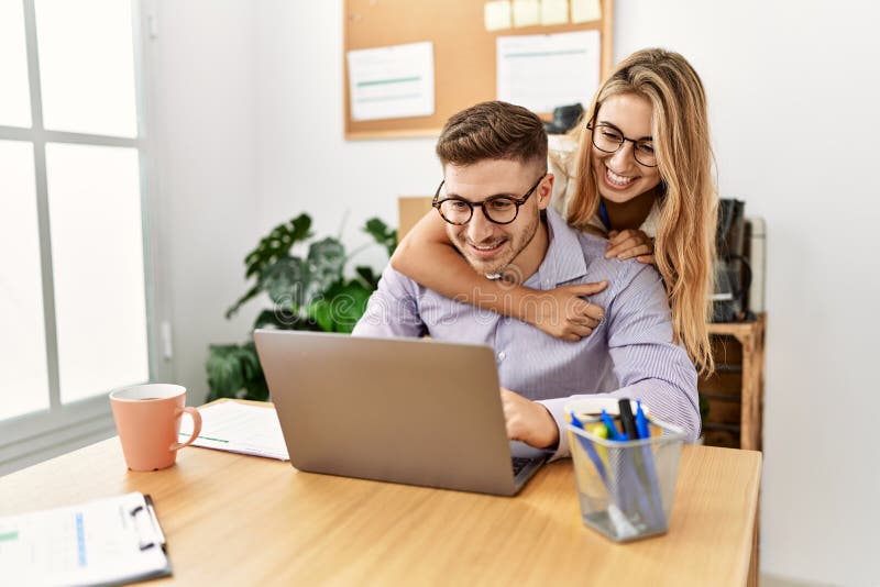 Two Business Workers Smiling Happy and Hugging Working at the Office ...
