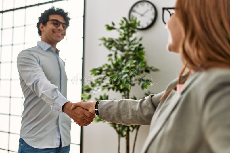 Two Business Workers Smiling Happy Shaking Hands at the Office Stock ...