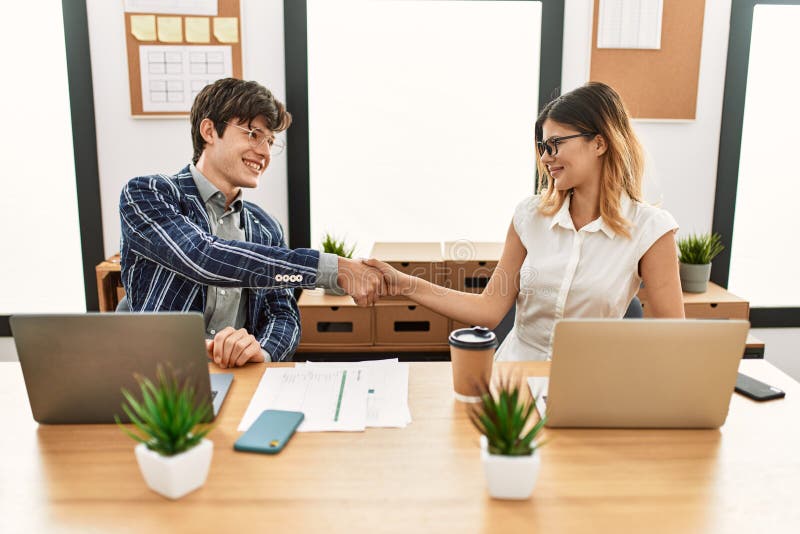 Two Business Workers Smiling Happy Shaking Hands at the Office Stock ...