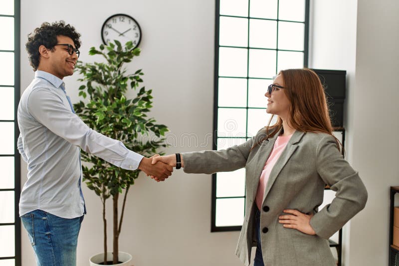 Two Business Workers Smiling Happy Shaking Hands at the Office Stock ...