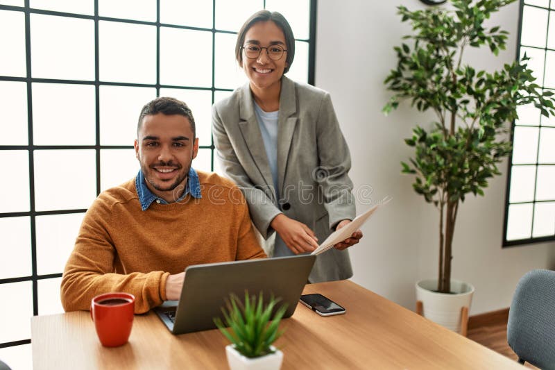 Two Business Workers Smiling Happy Working Sitting on Desk at the ...