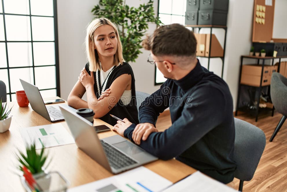 Two Business Workers Speaking and Working at the Office Stock Image ...