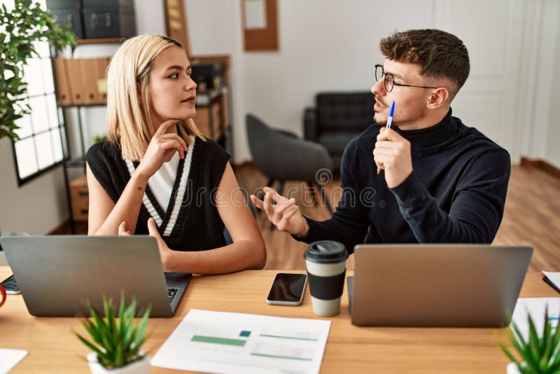 Two Business Workers Speaking and Working at the Office Stock Image ...