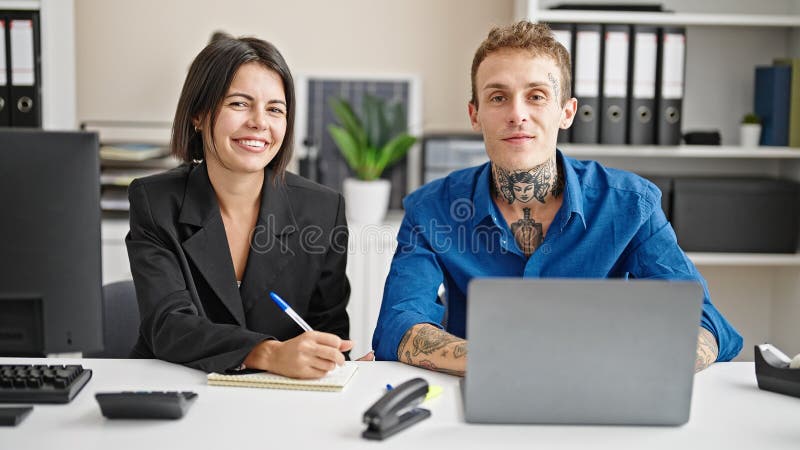 Two Business Workers Using Laptop Taking Notes at the Office Stock ...